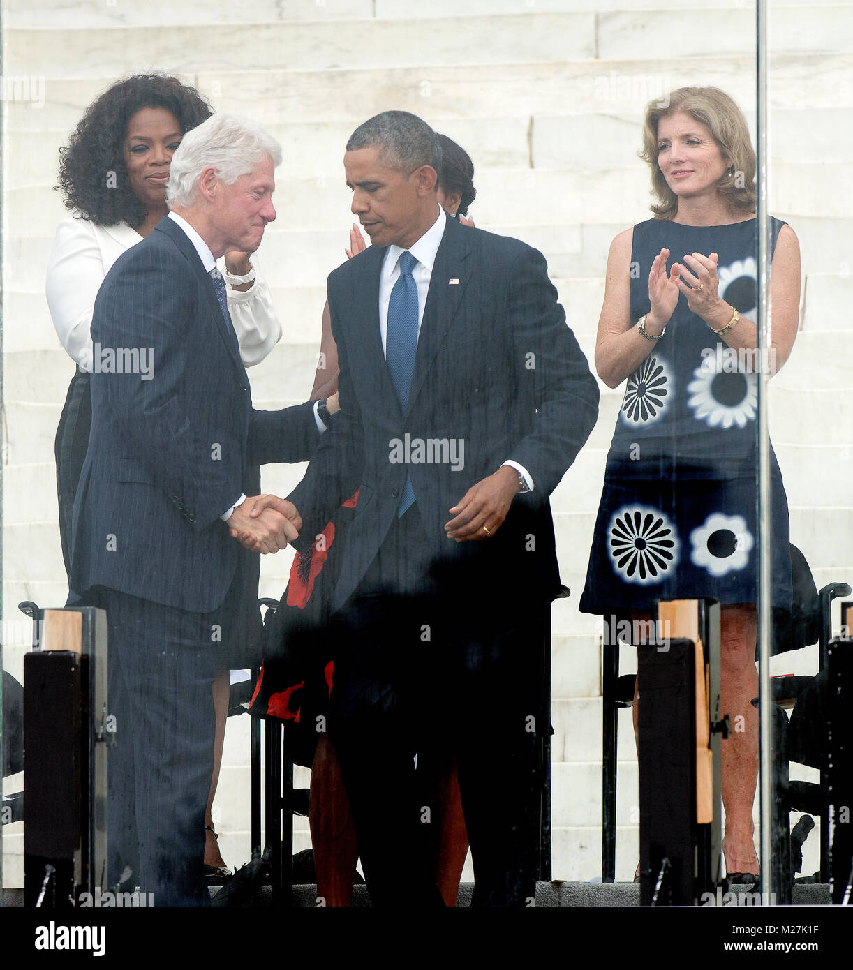 Former United States President Bill Clinton shakes hands with U.S ...