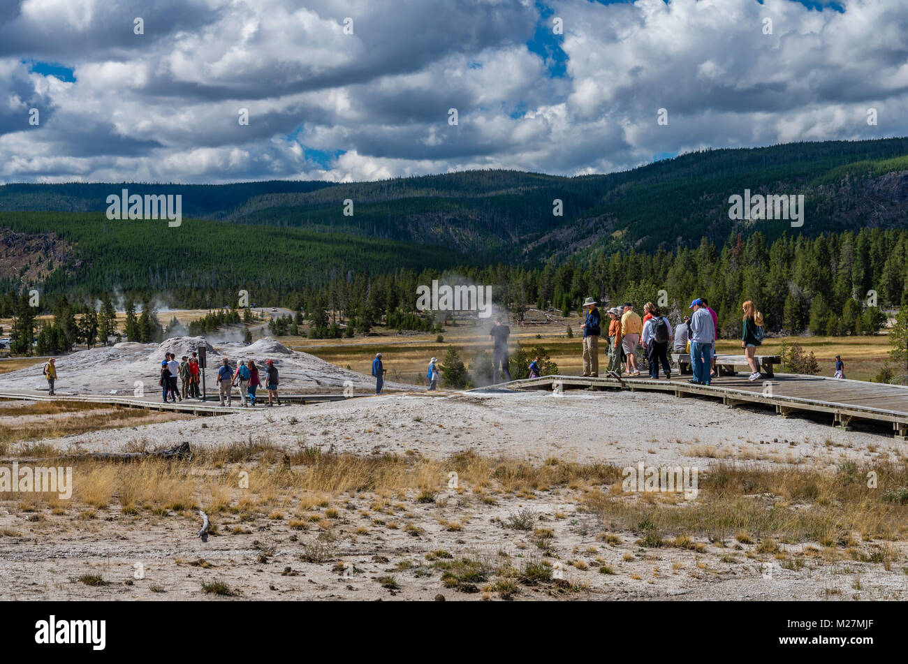 Tourists on the walkway near the Lion Group geysers. Upper Geyser Basin ...