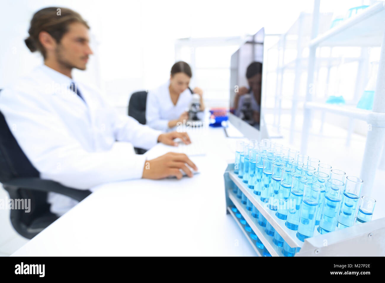 side view of scientists working in laboratory Stock Photo - Alamy