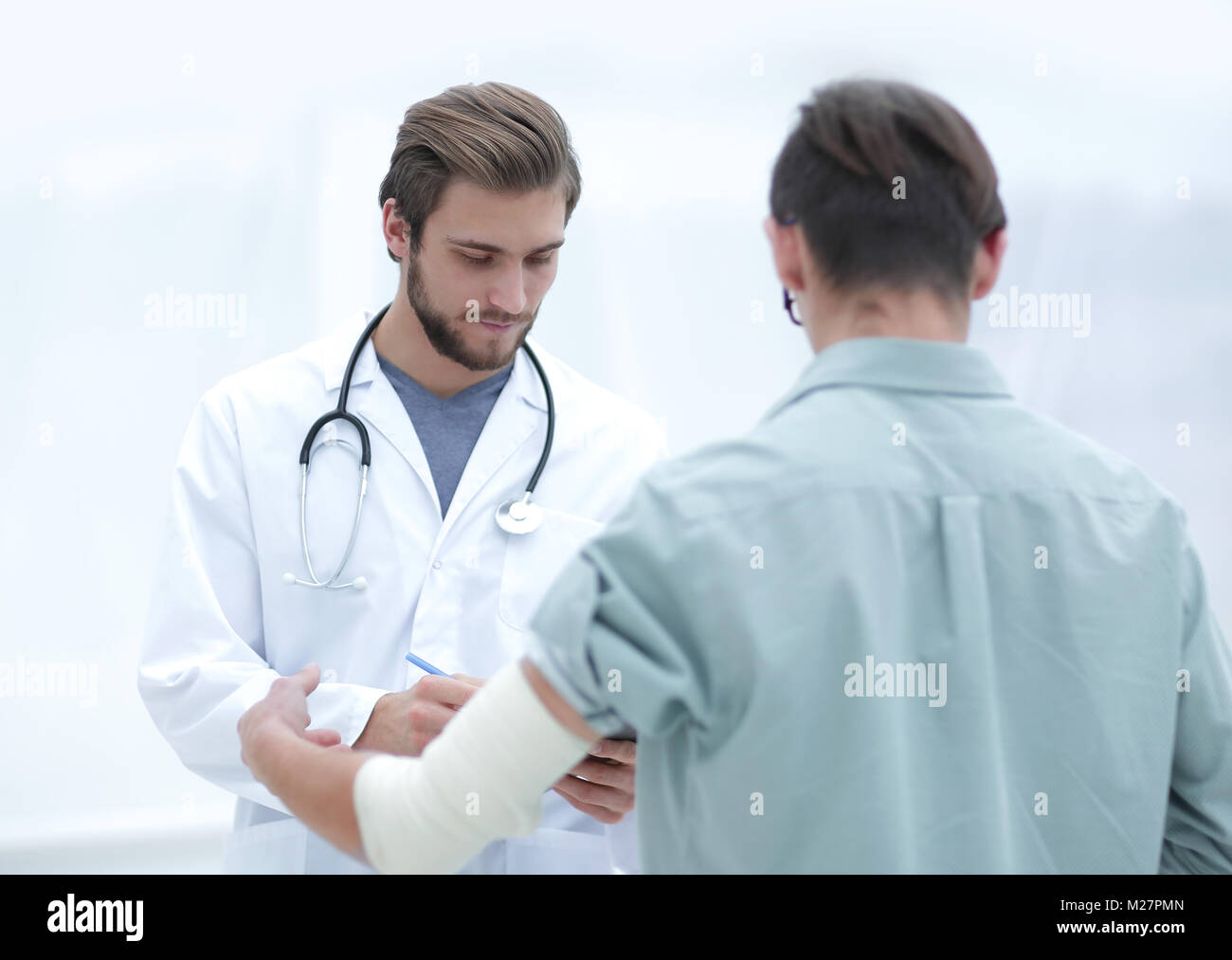 doctor writes a recommendation for the patient Stock Photo - Alamy