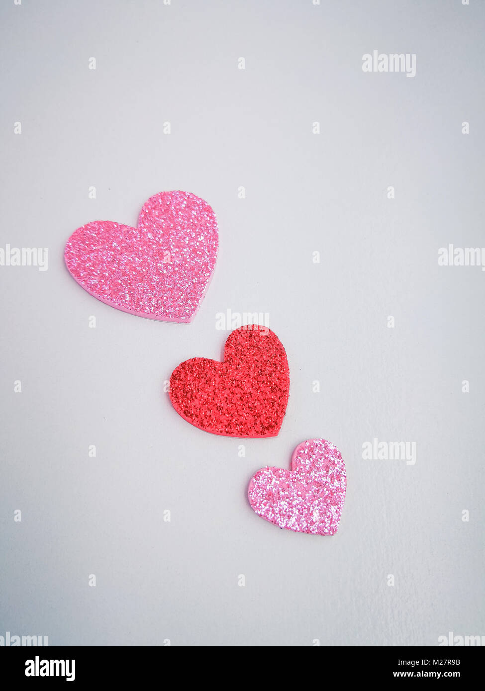 Happy Valentine's day. Pink and red paper hearts with glitters isolated ...