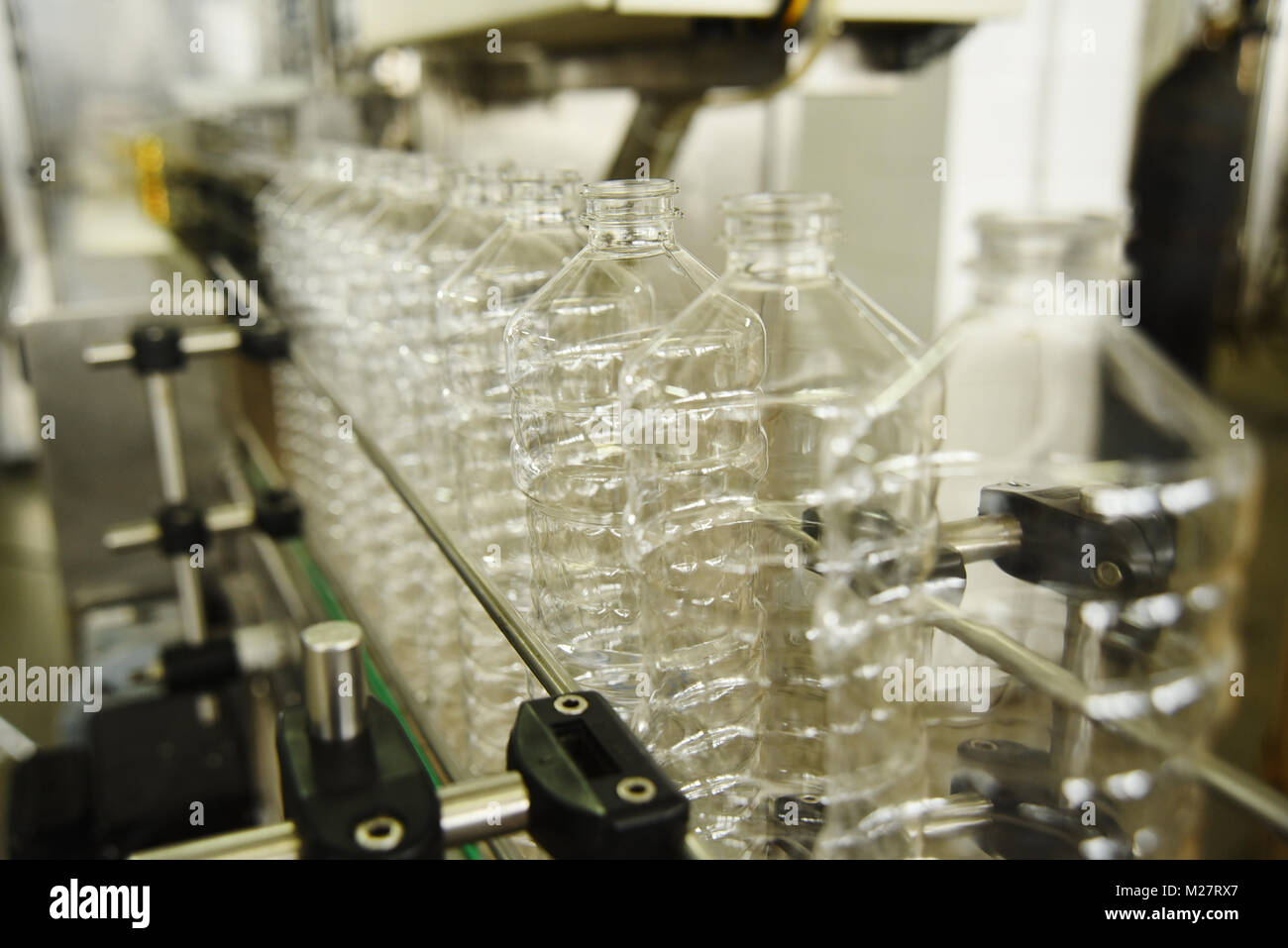 Bottle. Industrial production of PET bottles. Transparent packaging for ...