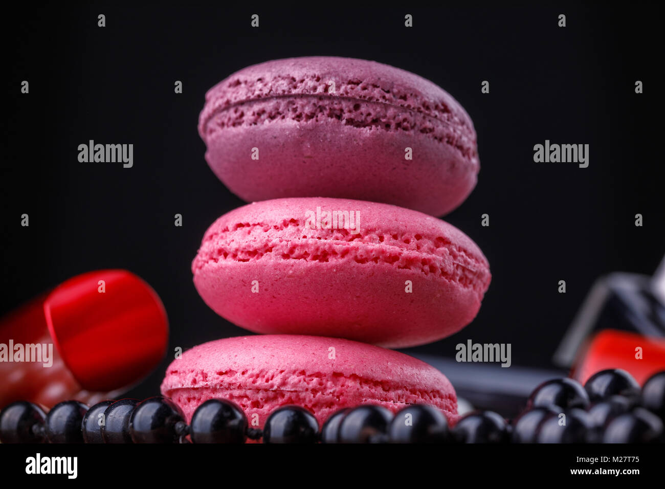 Macaroons of pink shades with a tube of varnish for an ideal manicure ...