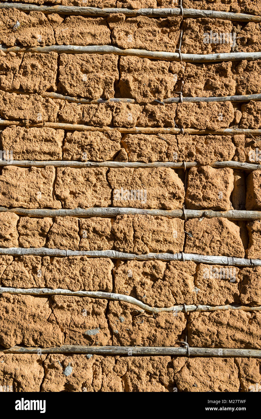 Background of traditional mud brick wall architecture layered with ...