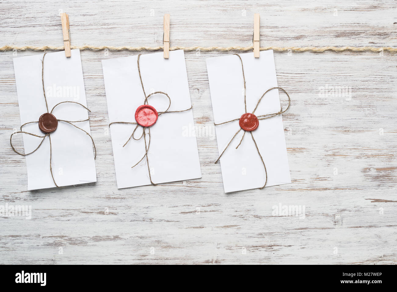 Mail envelope on rope Stock Photo - Alamy