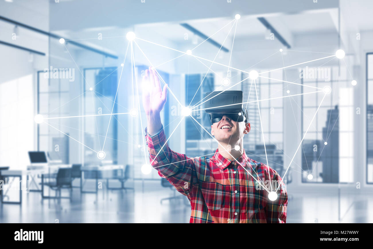 Guy wearing checked shirt and virtual mask reaching hand to touch ...