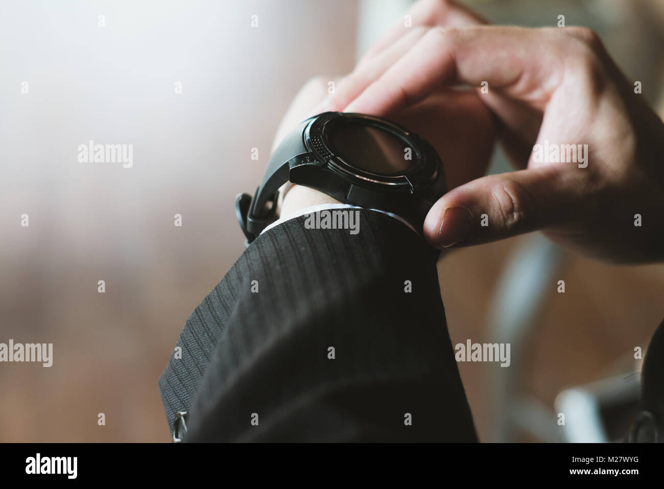 busy businessman look at watch at workplace. startup man check time on ...