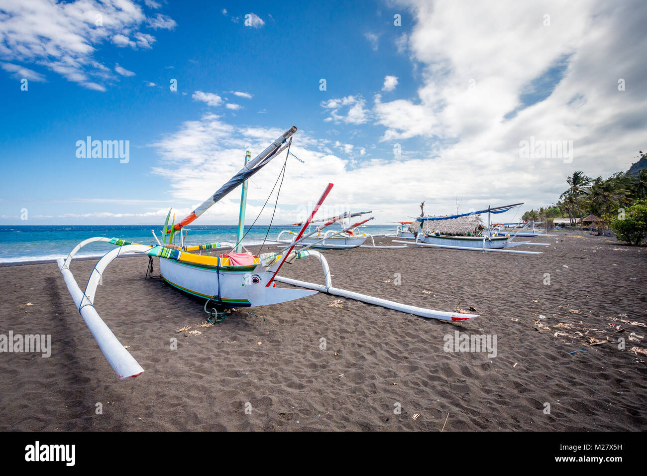Traditional catamaran boat, Bali Indonesia - black sand beach Stock ...
