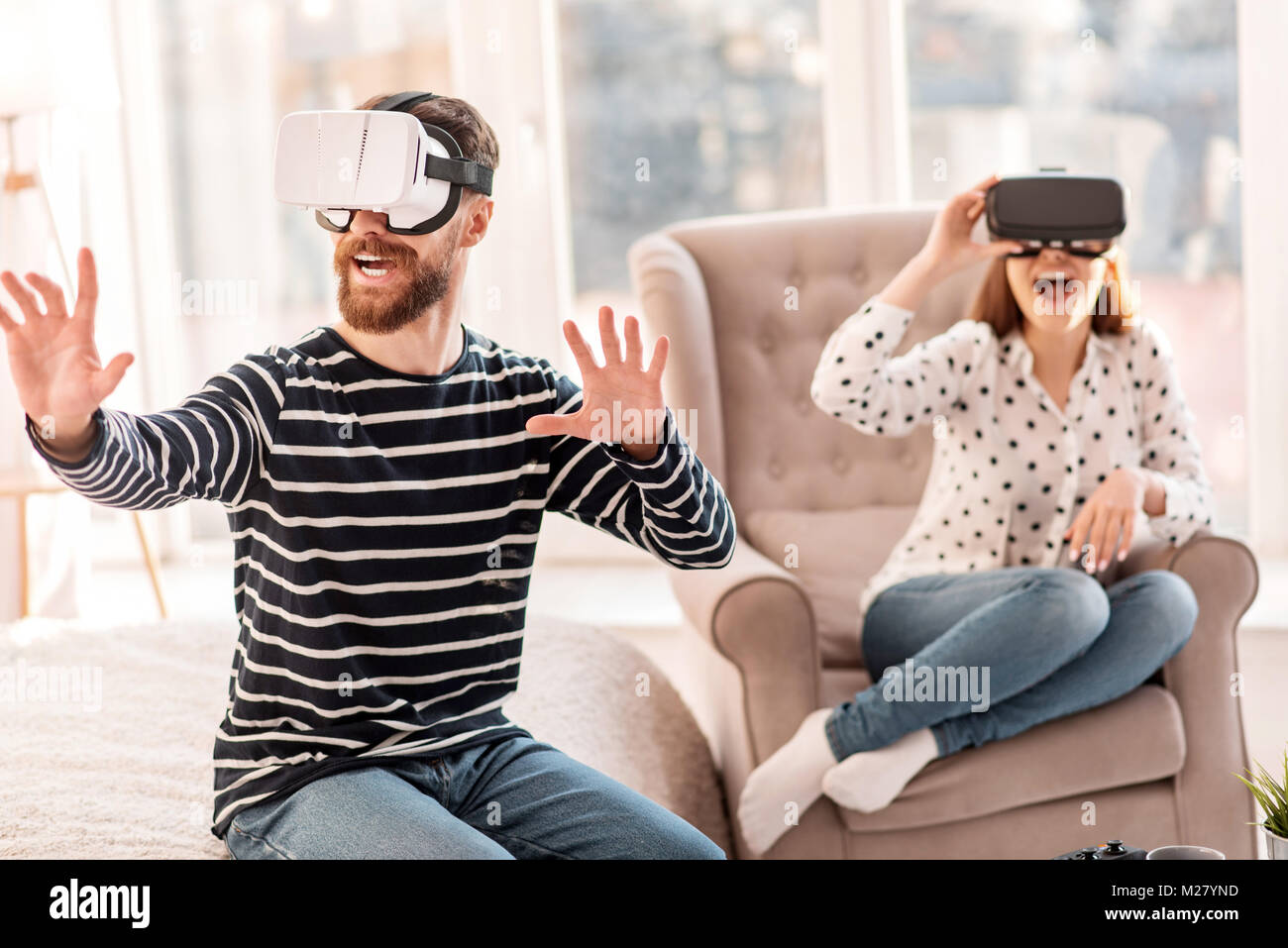 Cheerful jolly man moving in VR world Stock Photo - Alamy