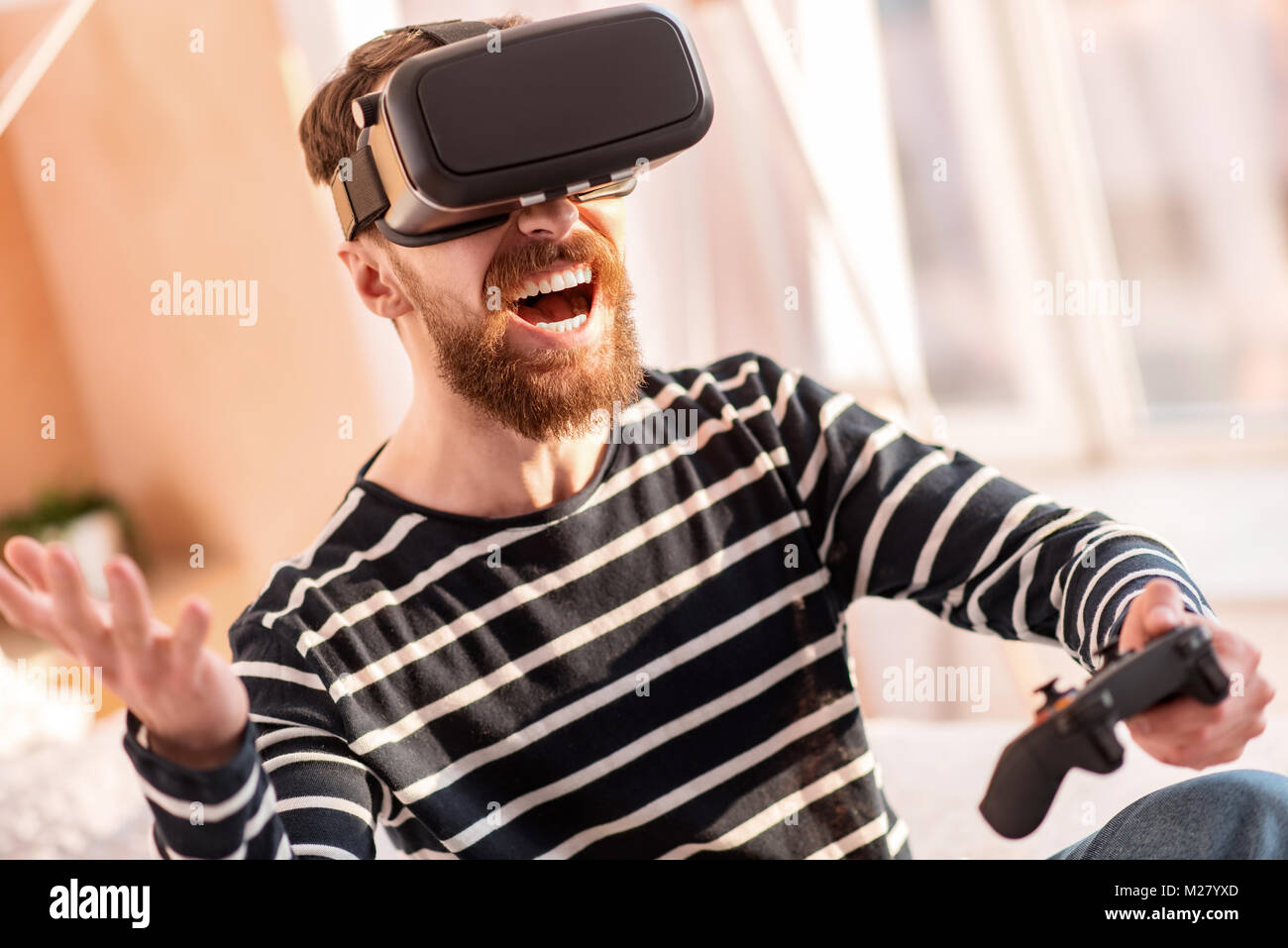 Glad merry man winning in VR game Stock Photo - Alamy
