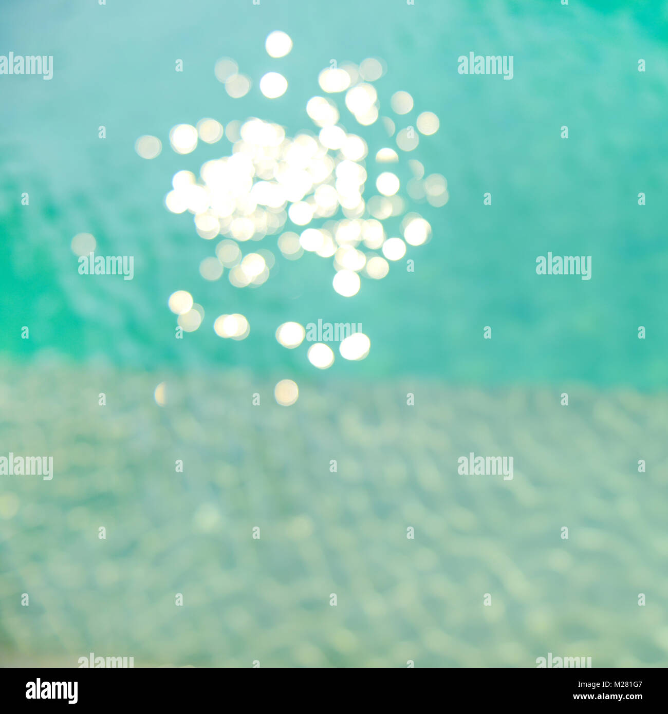 Soft focus bokeh light effects over a rippled, blue water background in the pool Stock Photo - Alamy