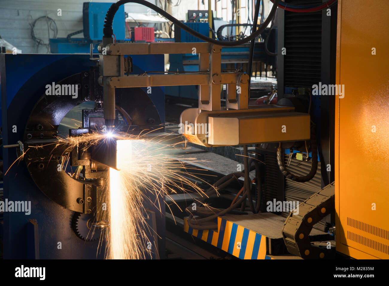 automatic laser machine cuts metal profile, close-up. pipe cutting ...