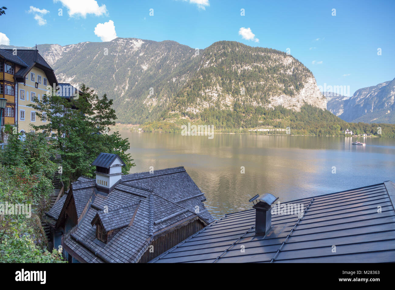View of Hallstatt village with fancy mountain houses by Hallstatt lake ...