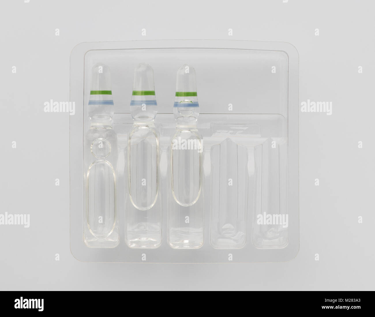 Medical ampoules of liquid for injection in plastic containers on a ...