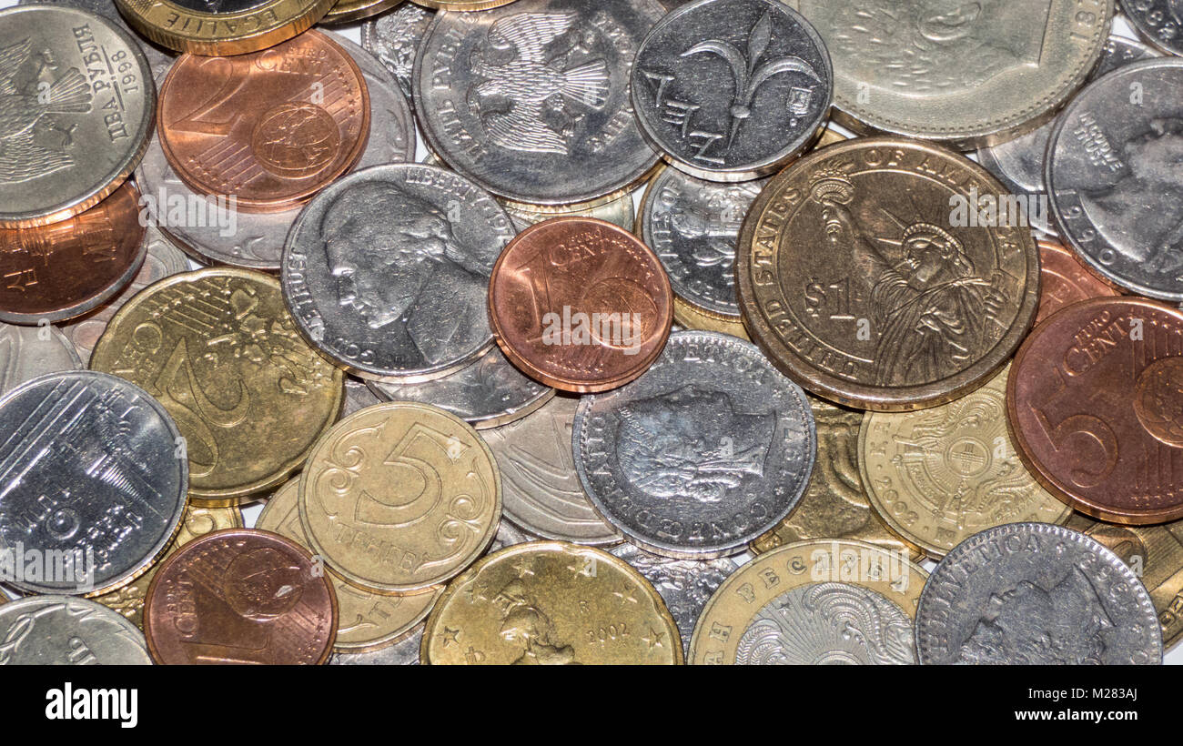 A lot of different metal coins, view from above. background of coins ...