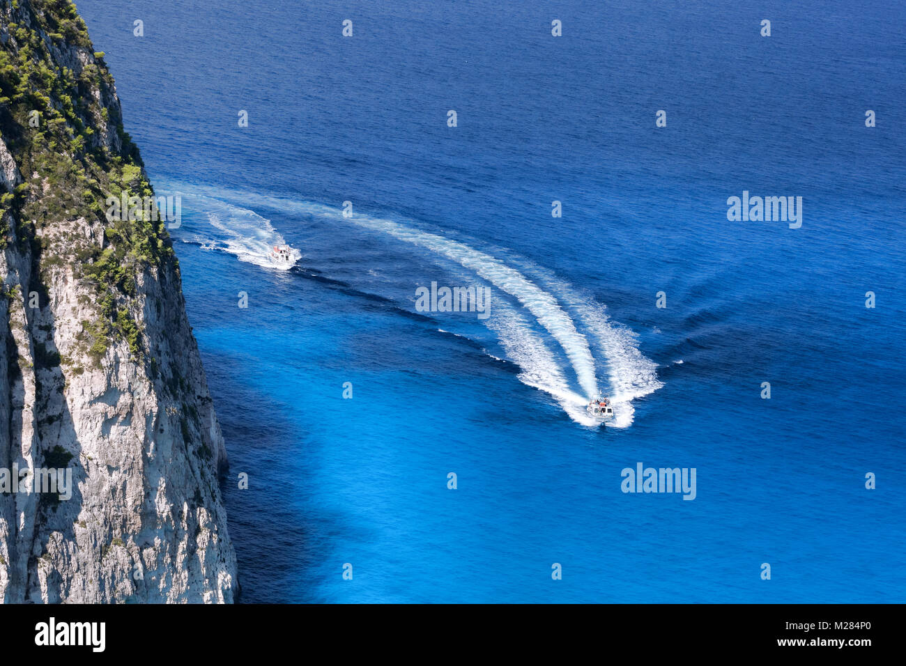 Azure bay with boats in Greek sea Stock Photo - Alamy