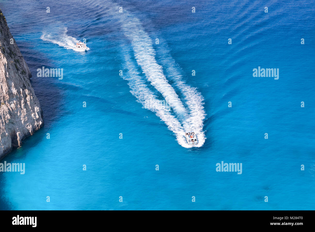 Azure bay with boats in Greek sea Stock Photo - Alamy