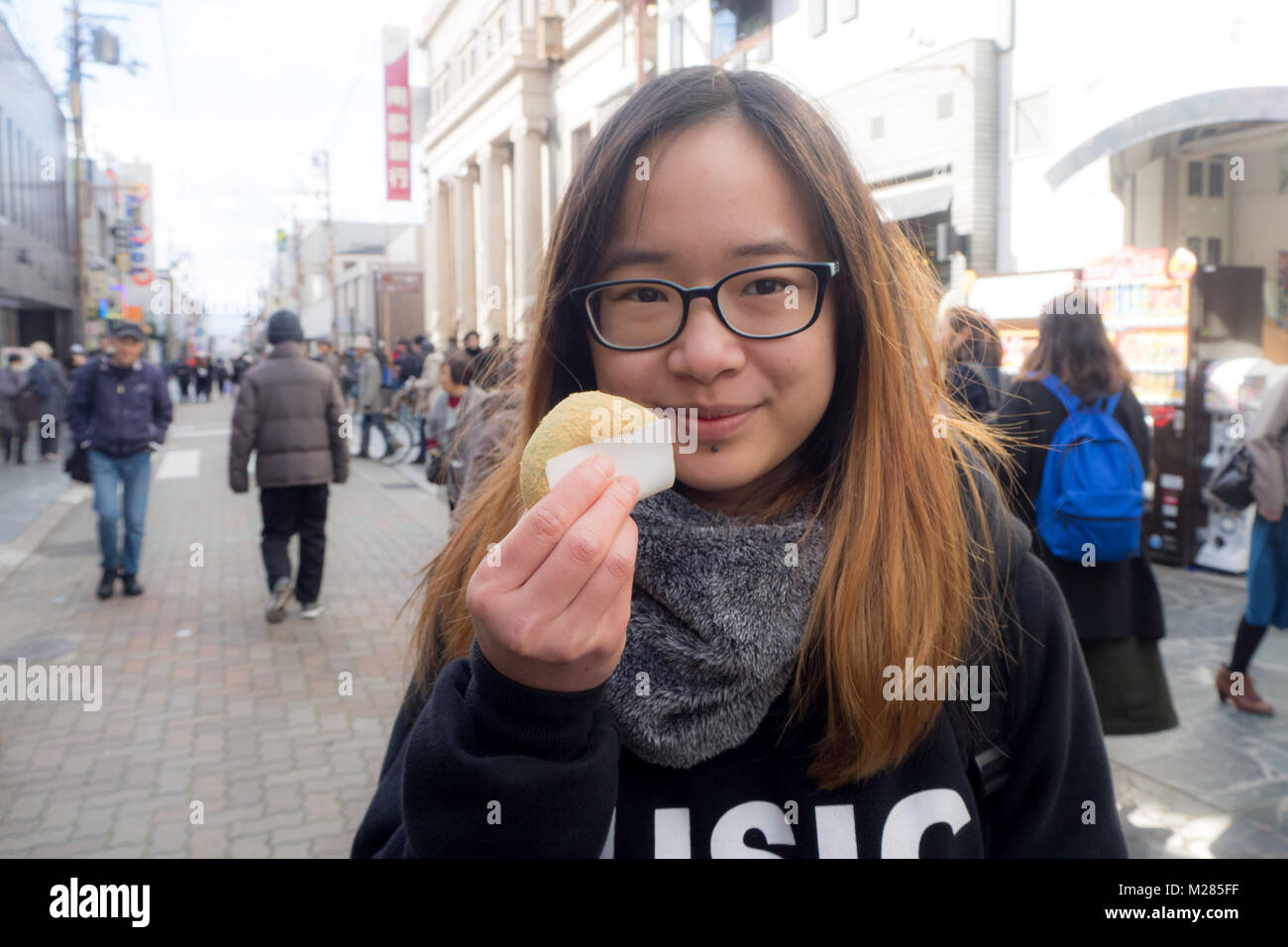girl eating Mochi a japanese rice cake dessert made fresh Stock Photo ...