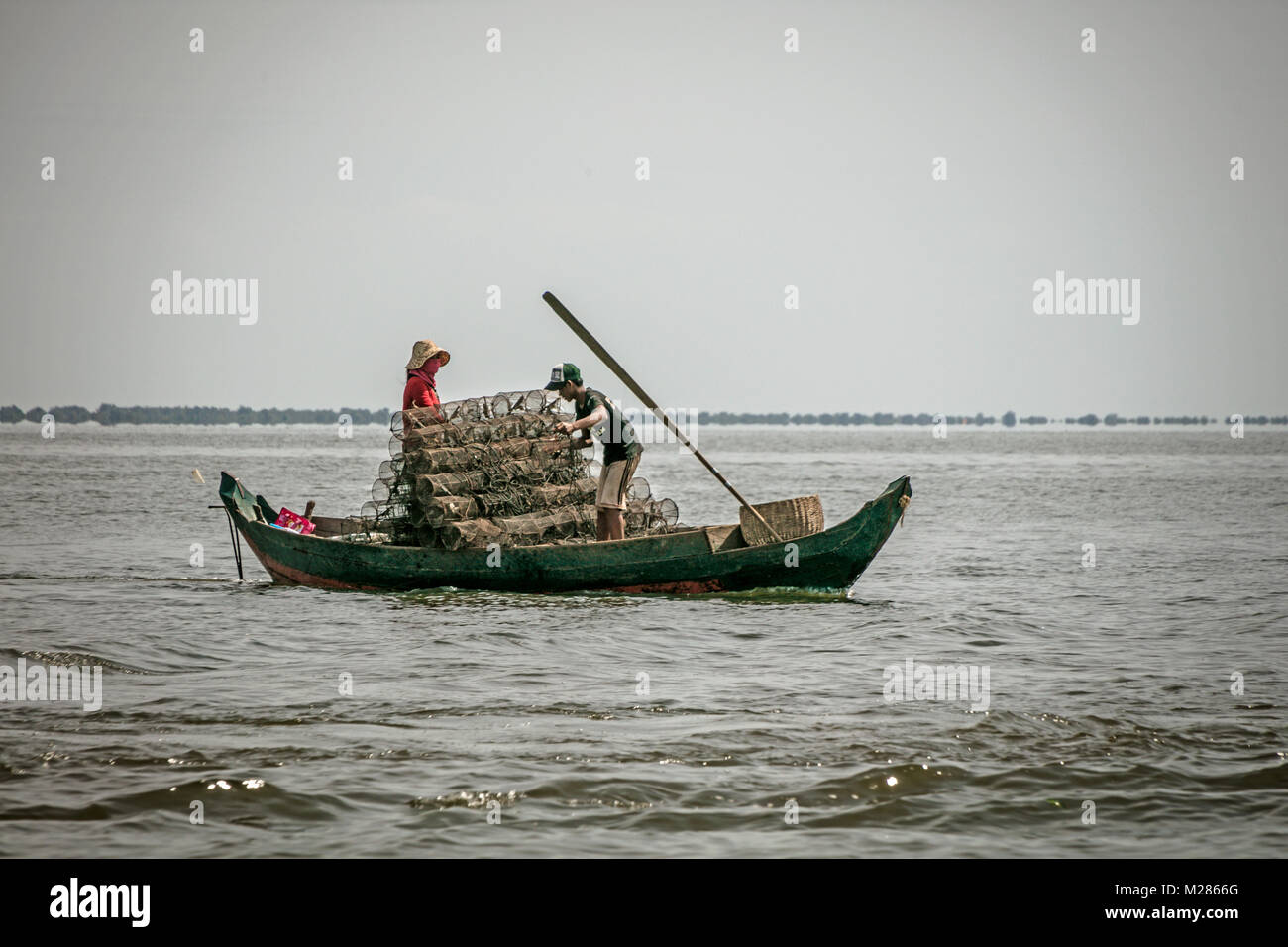 Fisherman laying nets Tonle Sap lake near Kampong Phluk Floating ...