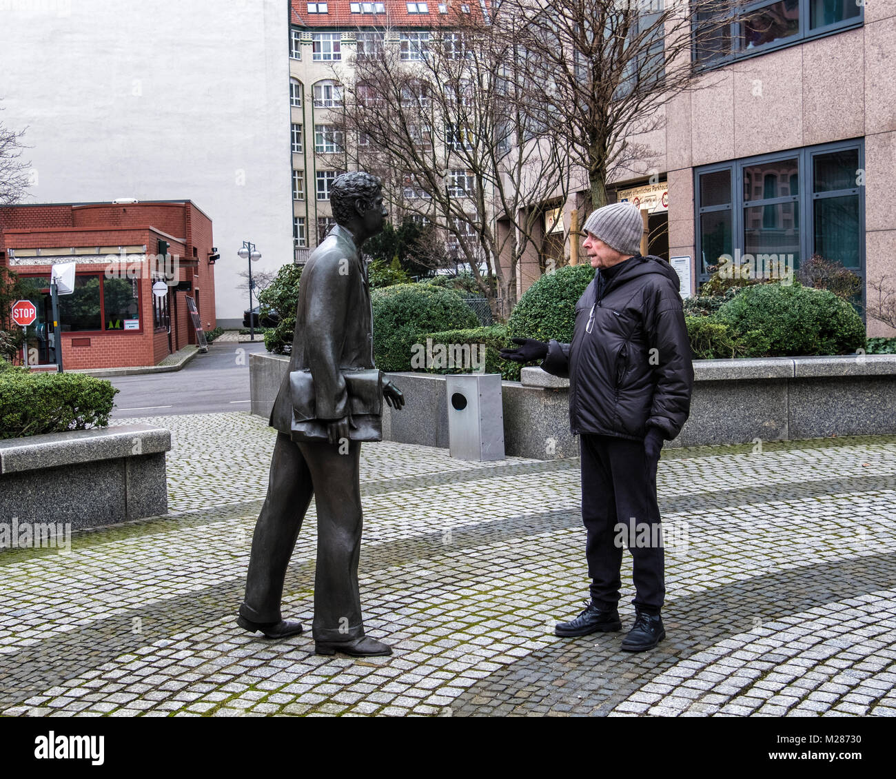Bronze scupture of man wearing suit with briefcase hi-res stock ...