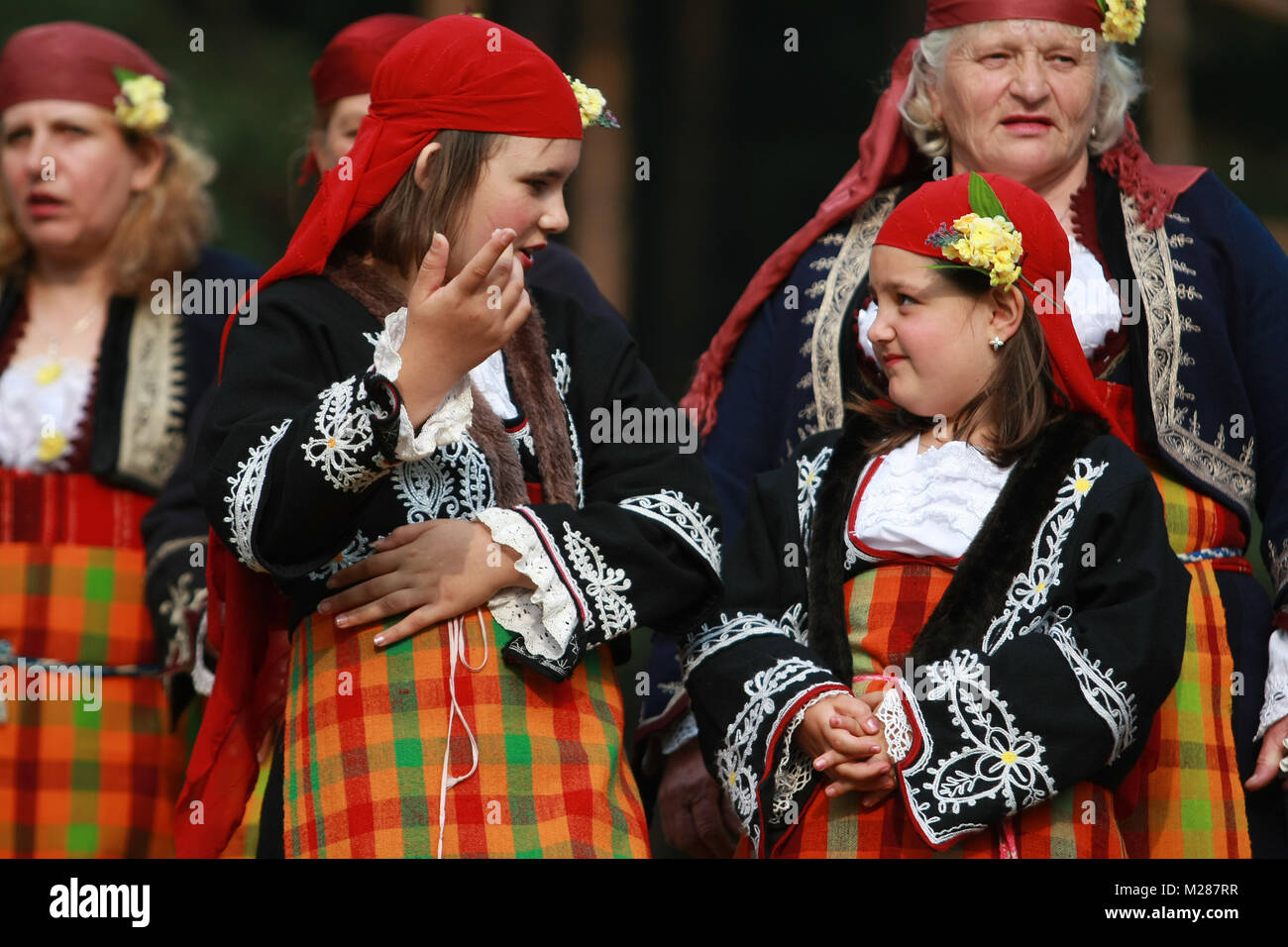People in traditional folk costume of The National Folklore Fair in ...