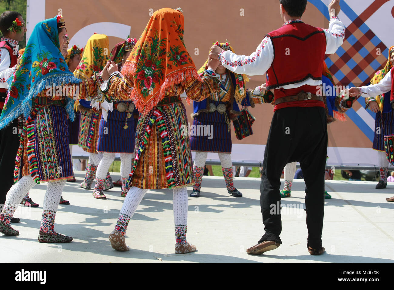 People in traditional folk costume of The National Folklore Fair in ...