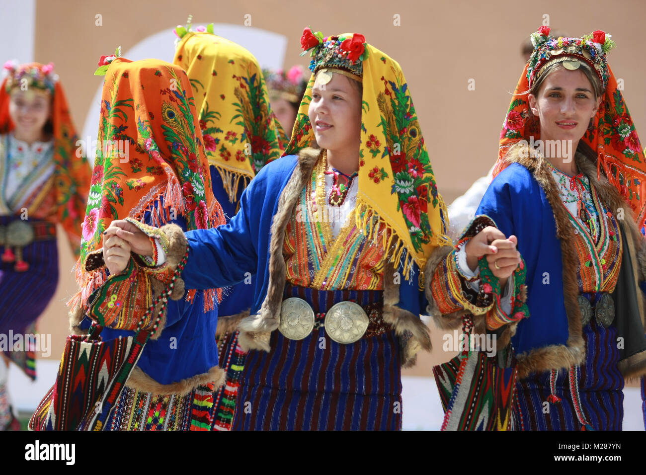 People in traditional folk costume of The National Folklore Fair in ...