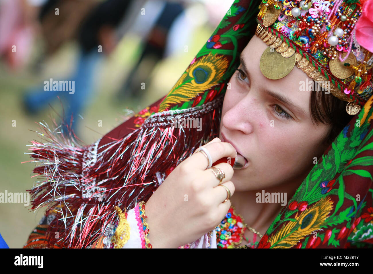 People in traditional folk costume of The National Folklore Fair in ...