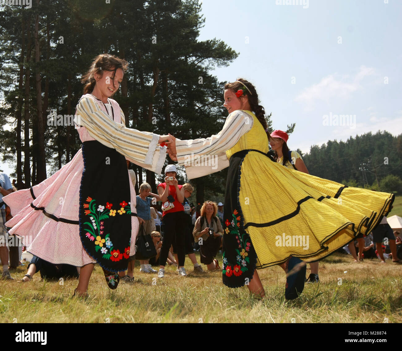 People in traditional folk costume of The National Folklore Fair in ...