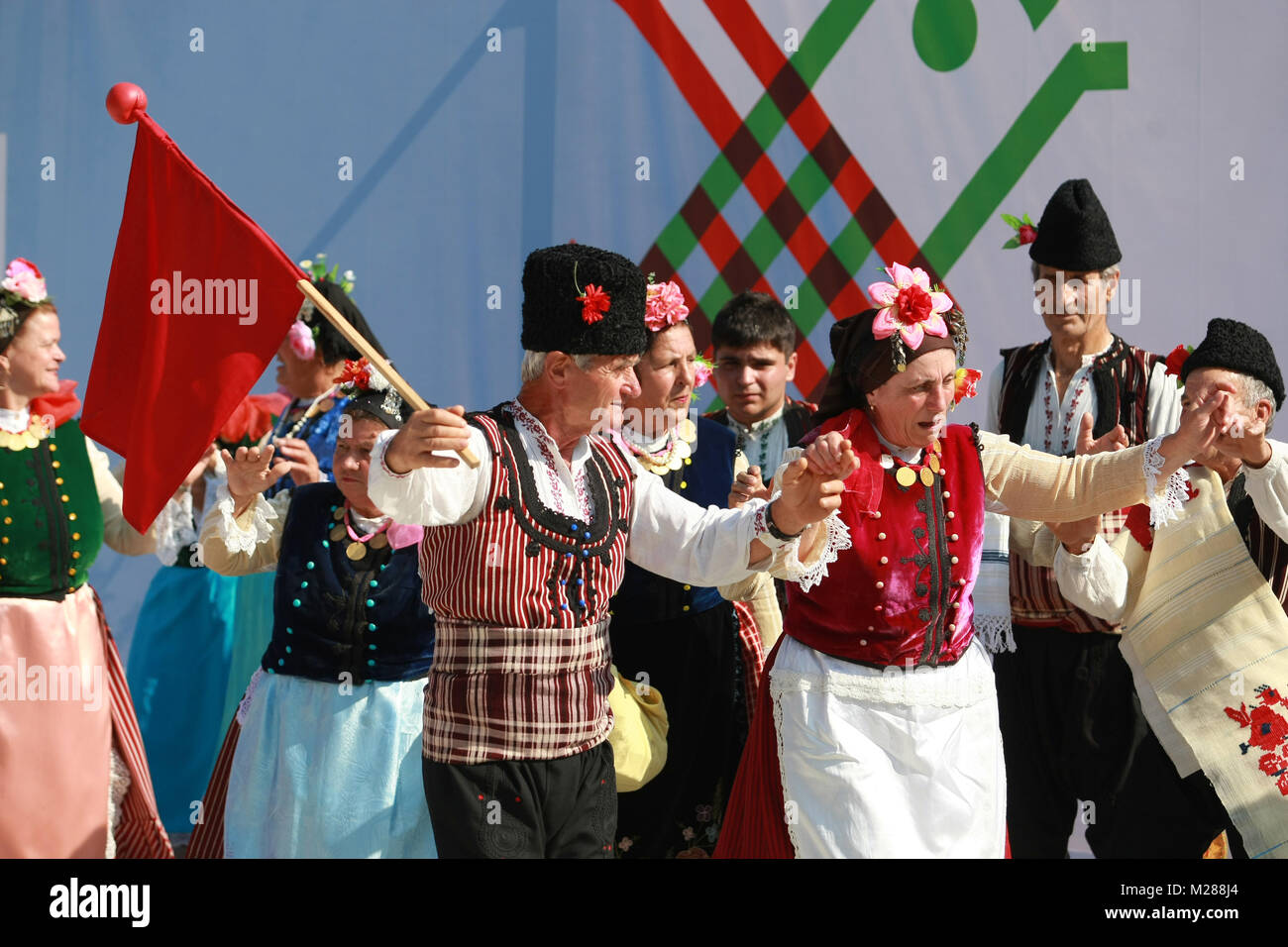 People in traditional folk costume of The National Folklore Fair in ...