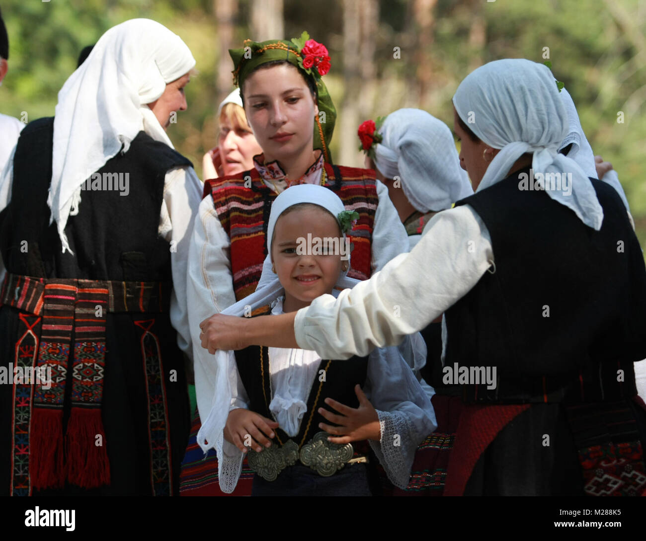 People in traditional folk costume of The National Folklore Fair in ...
