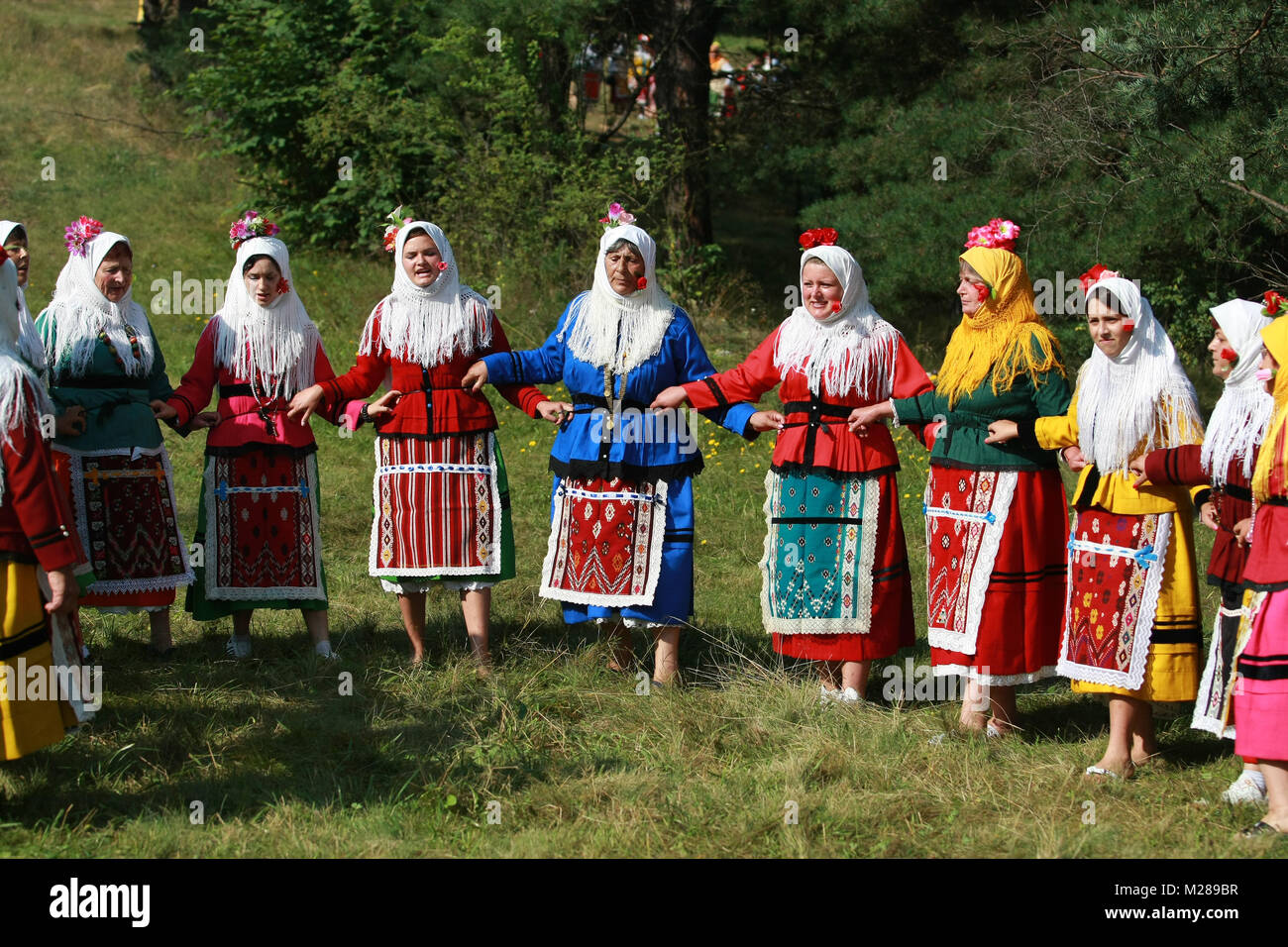 People in traditional folk costume of The National Folklore Fair in ...