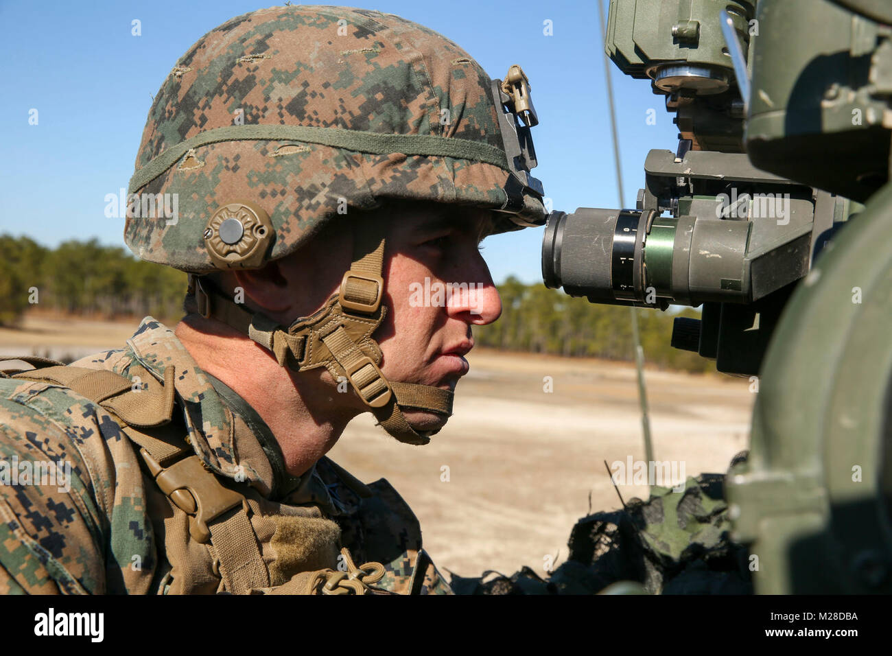 A Marine operates a Saber optic system to view distant targets during a ...