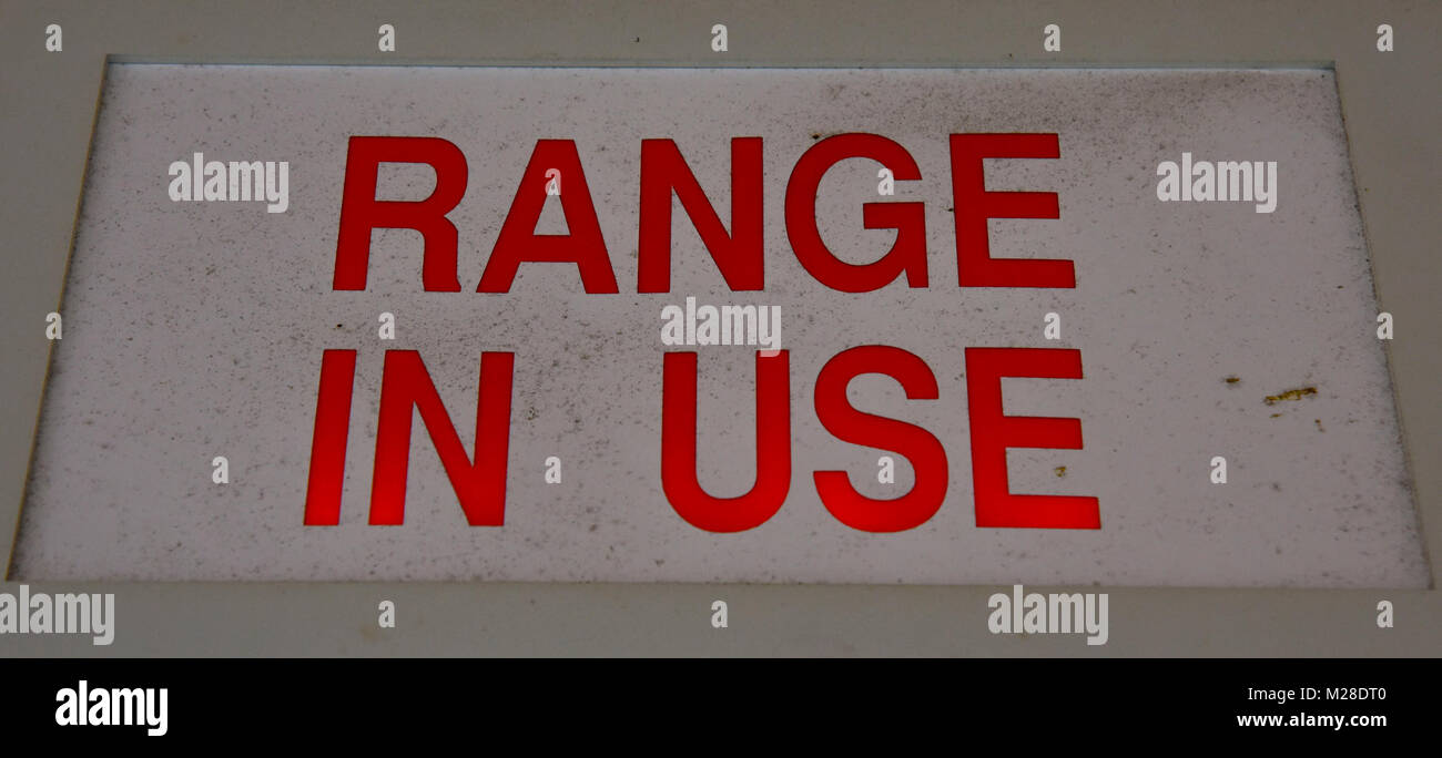 A Range in Use sign glows as a warning for Airmen entering the combat ...
