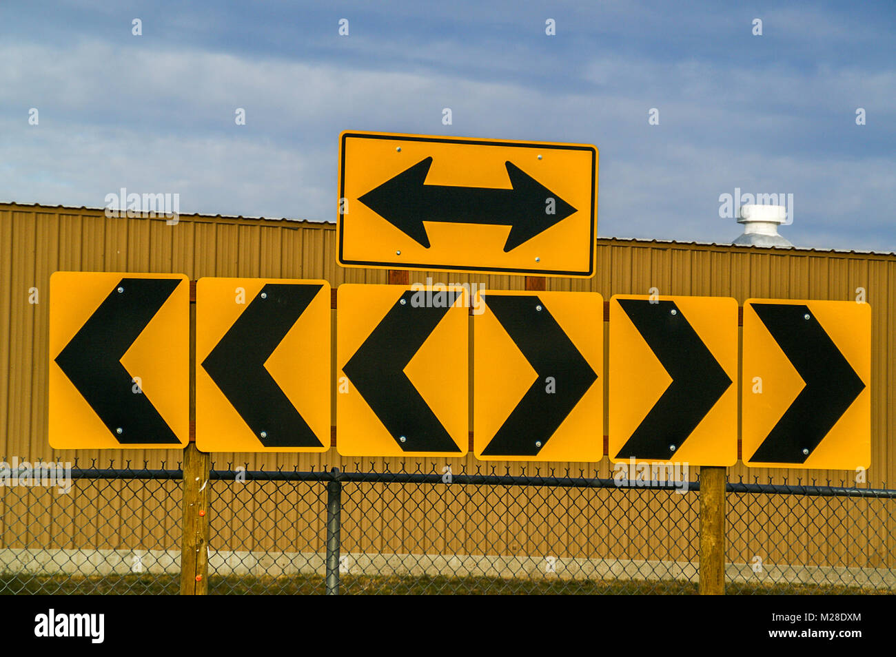 Arrows and chevrons to inform motorists that they must turn either left ...
