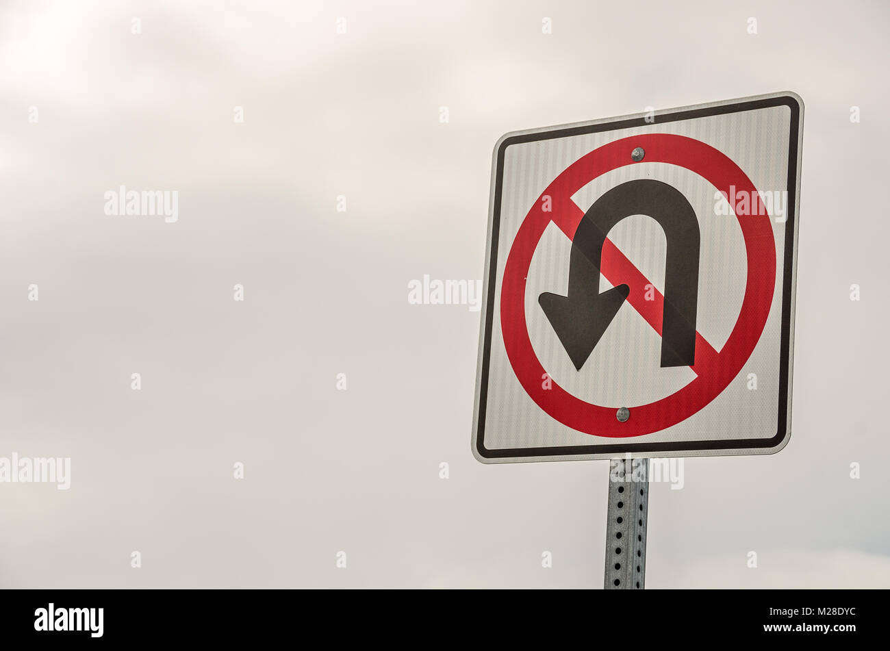Red, white, and black sign with symbols to tell drivers they cannot ...