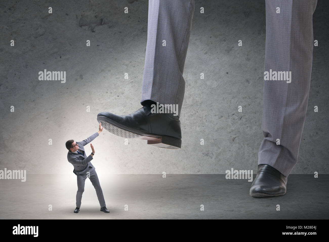 Bad angry boss stamping on employee in business concept Stock Photo - Alamy