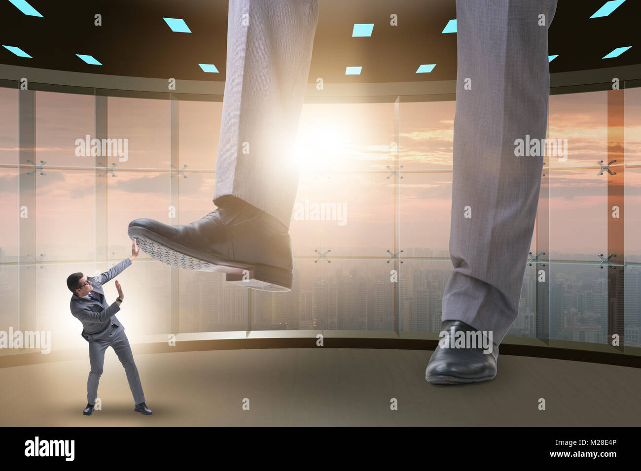 Bad angry boss stamping on employee in business concept Stock Photo - Alamy