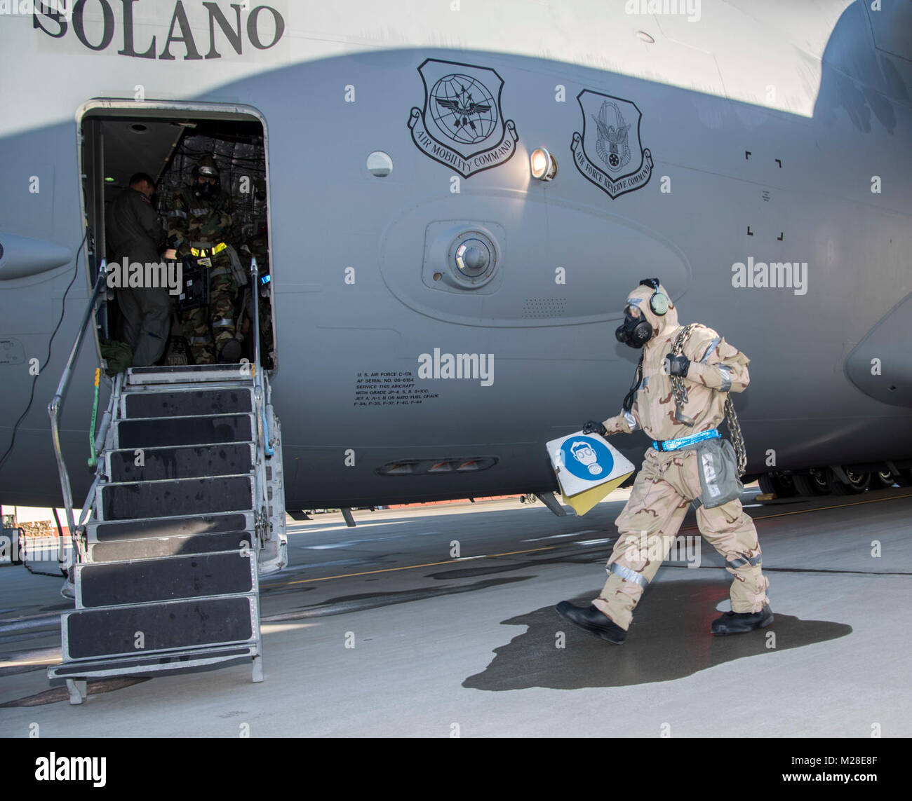 An Airman from the 860th Aircraft Maintenance Squadron brings a ...