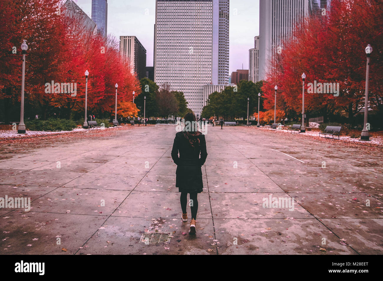 Girl Walking Through City Stock Photo - Alamy