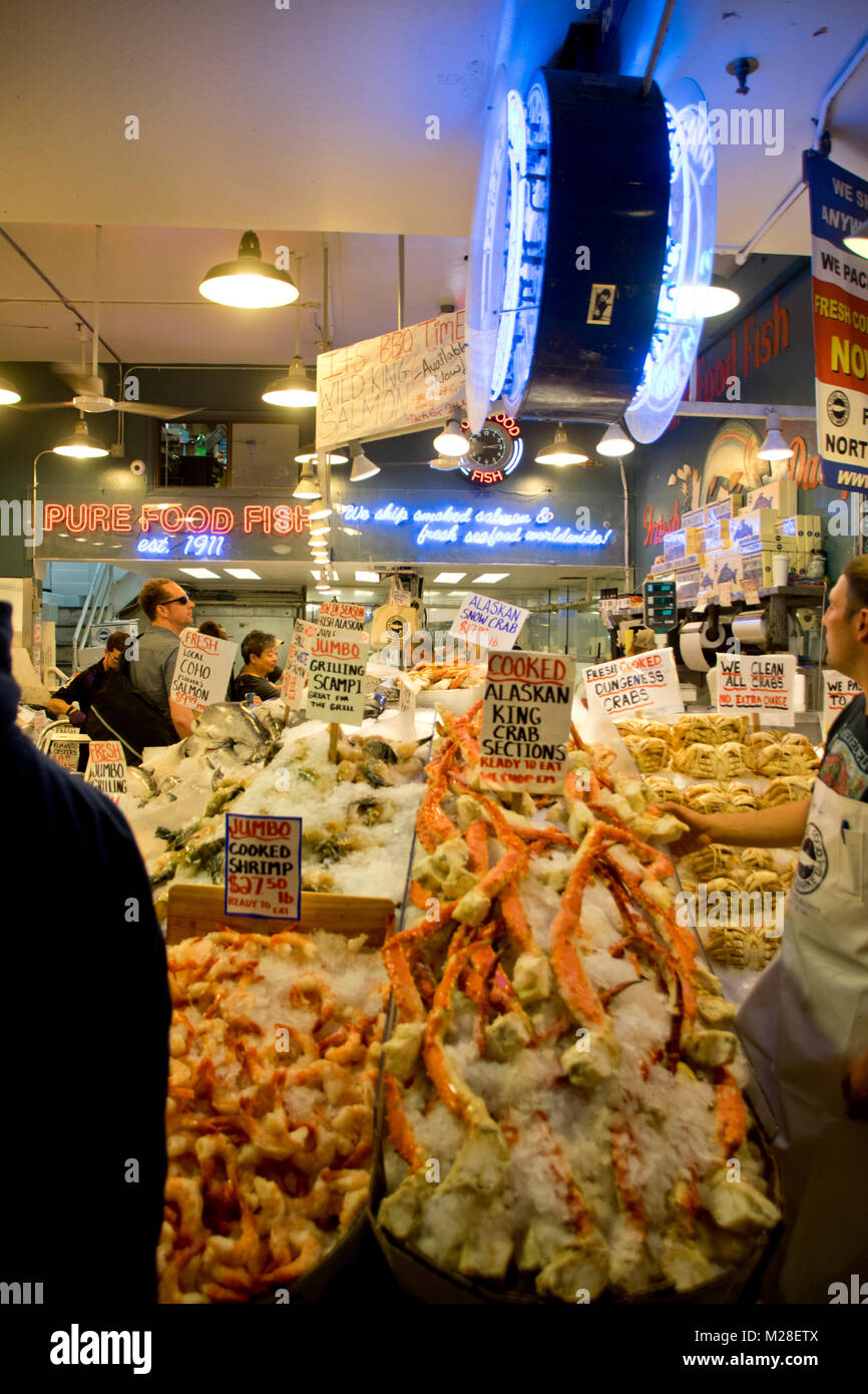 An array of seafood for sale at Pike Place Fish Market in Seattle ...