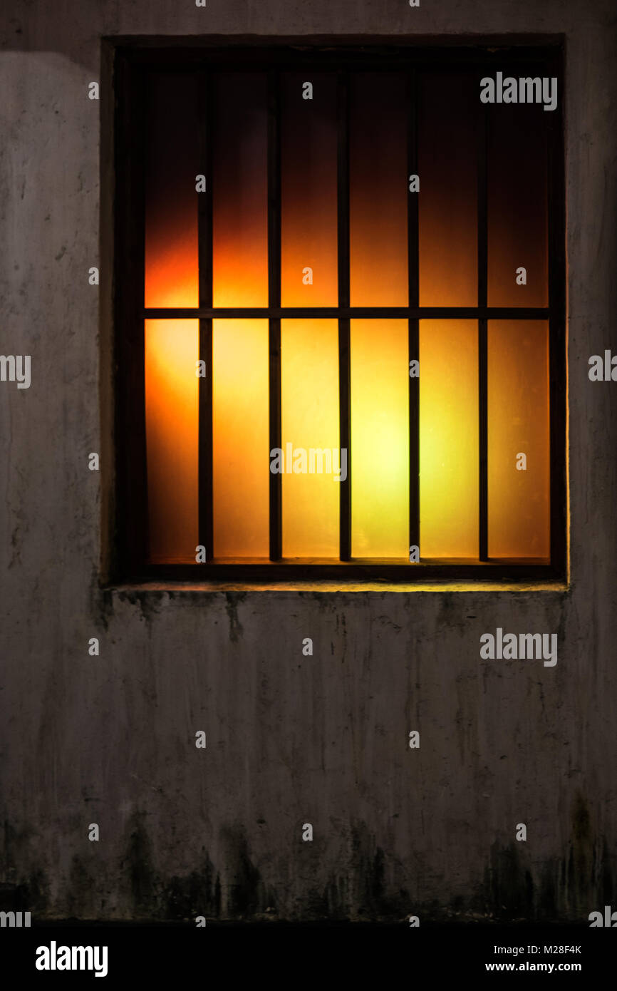 Ominous Window with warm light Stock Photo - Alamy