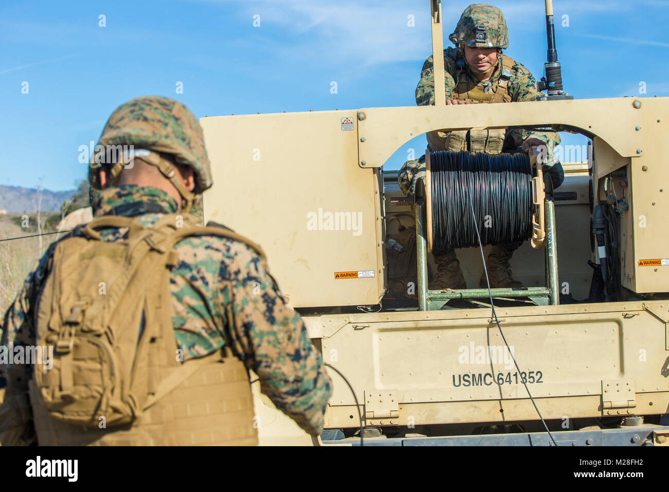 U.S. Marine Corps Lance Cpl. Andres Suarez, a Network Administrator ...