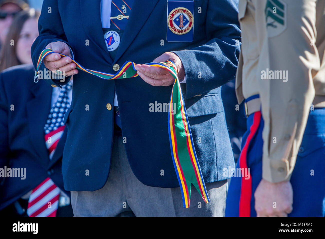 A.J. Burns, a 1st Marine Division veteran, holds a Navy Unit ...