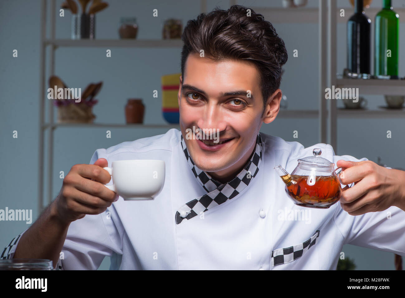 Tea expert brewing cup of drink Stock Photo - Alamy