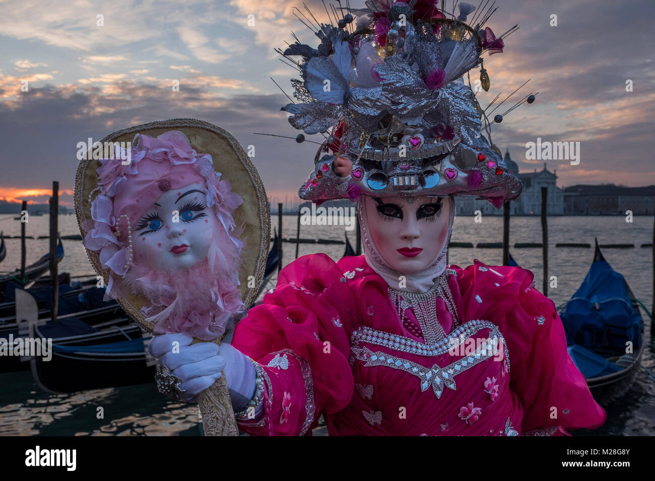 VENICE, ITALY - FEBRUARY 04: People wearing carnival costumes pose in ...