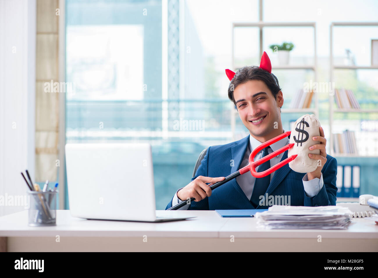 Devil angry businessman in the office Stock Photo - Alamy