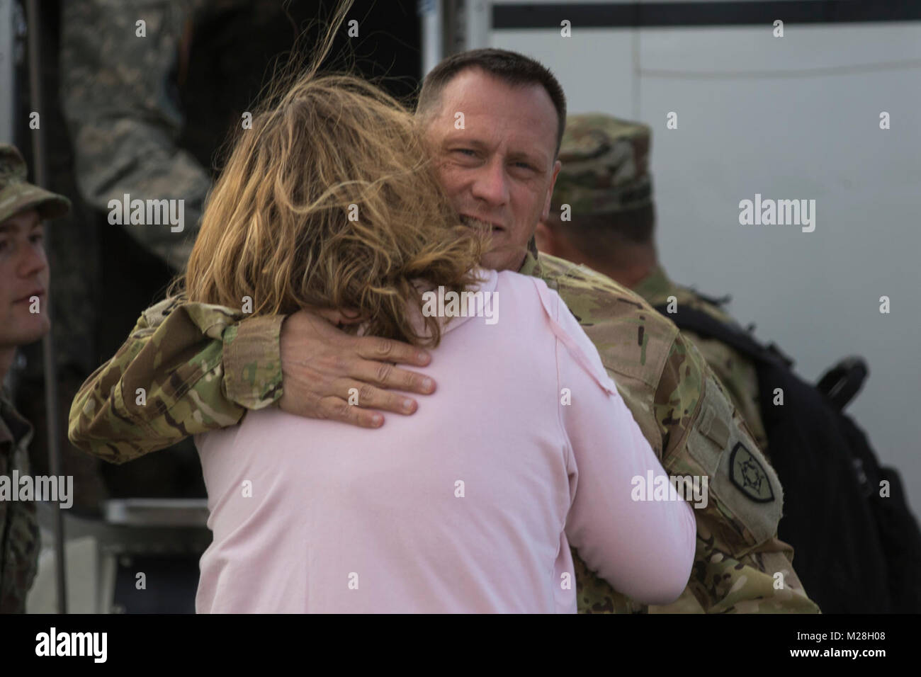 Chief Warrant Officer 5 Jason Graff of Lincoln, Nebraska, hugs his wife ...