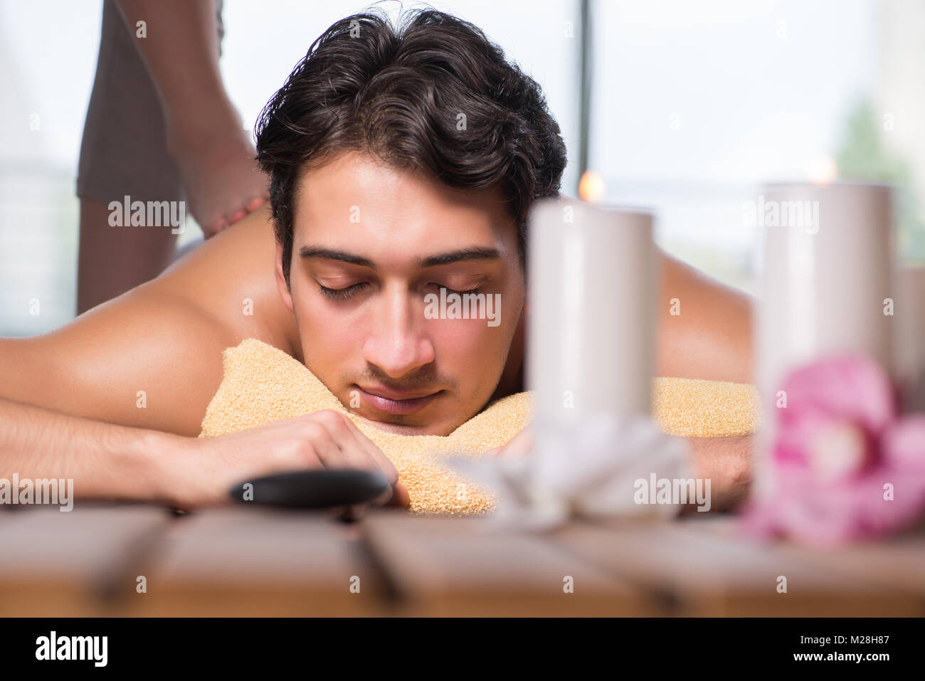Young handsome man during spa procedure Stock Photo - Alamy