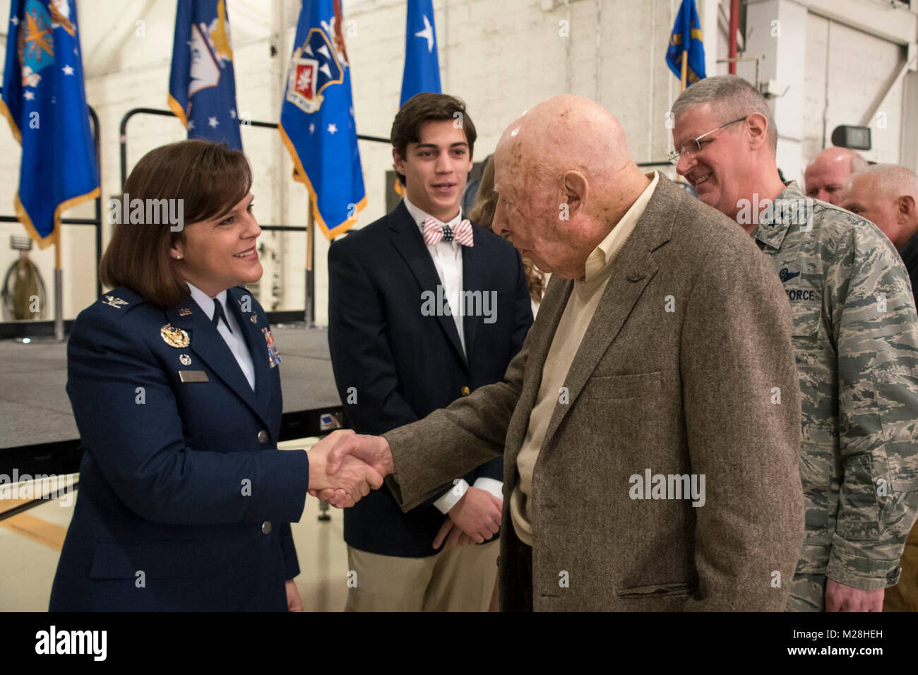 Col. Allison Miller shakes hands with Jim Gorman, a charter member of ...